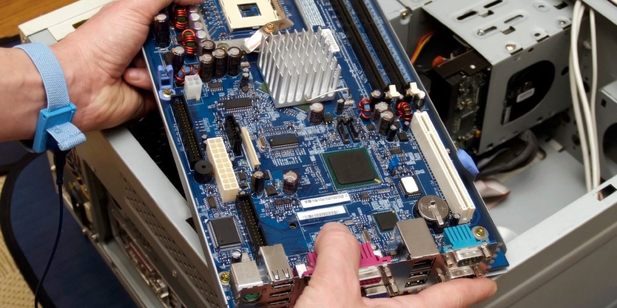 How to install a motherboard and CPU – Grinder Custom Computers